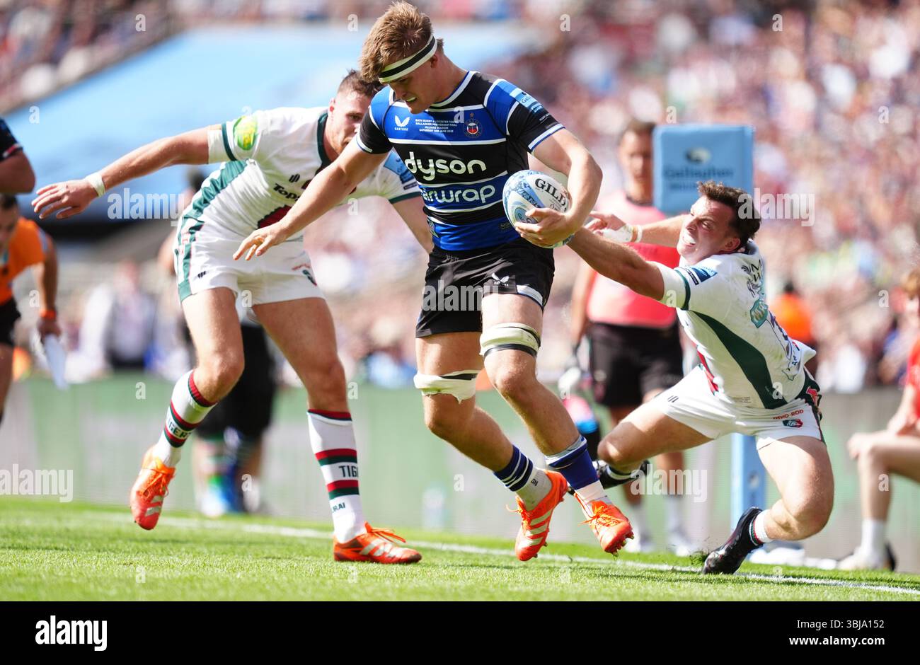Bath Rugby's Guy Pepper is tackled by Leicester Tigers' Freddie Steward ...
