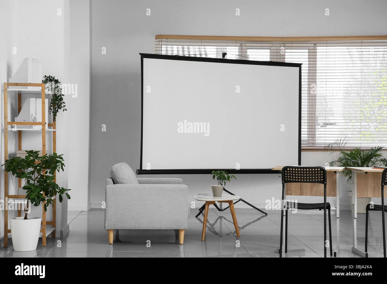 Interior of empty classroom with blank projector screen and desks Stock ...
