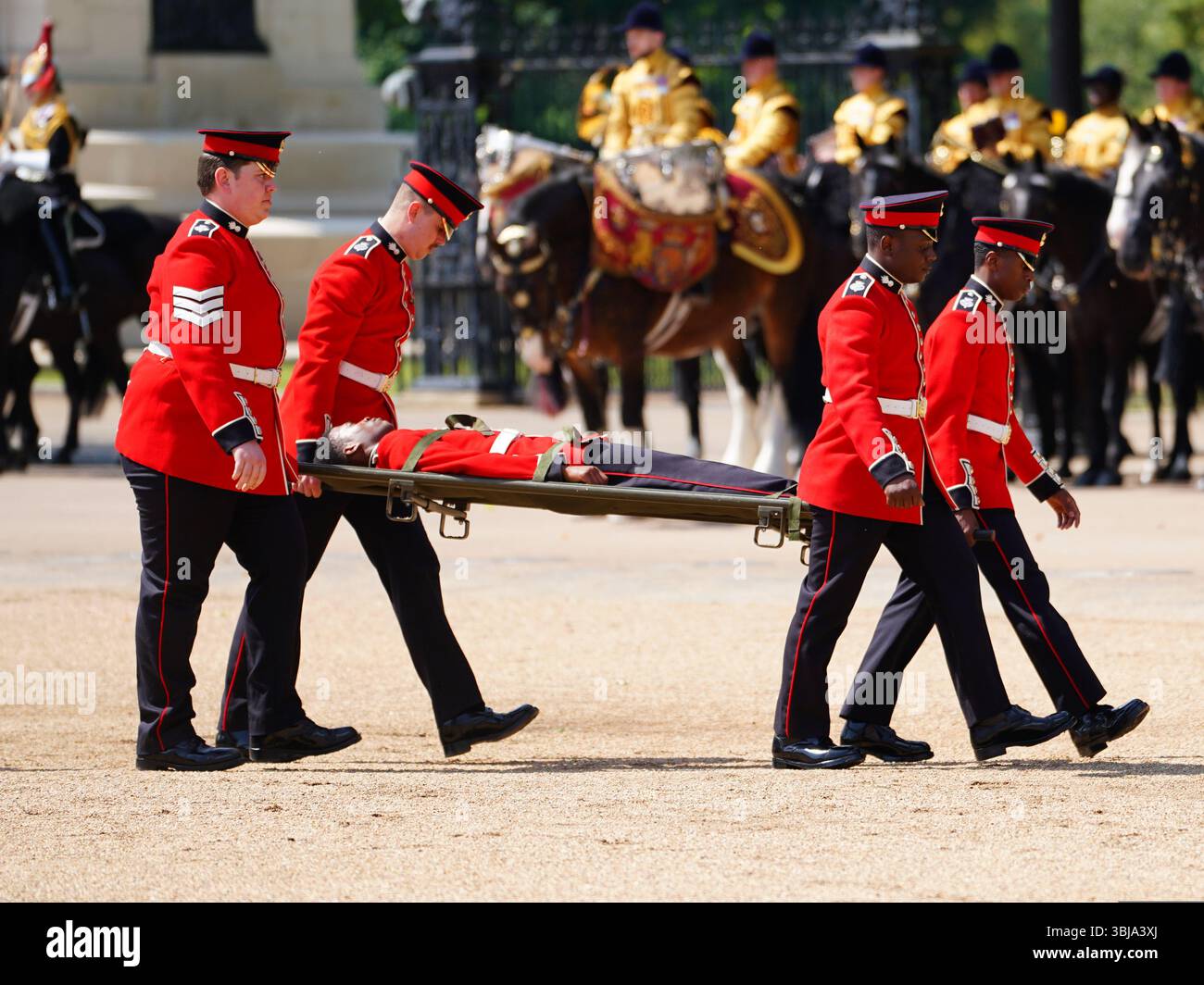 LONDON, ENGLAND - JUNE 14: A soldier is stretchered off Horse Guards ...