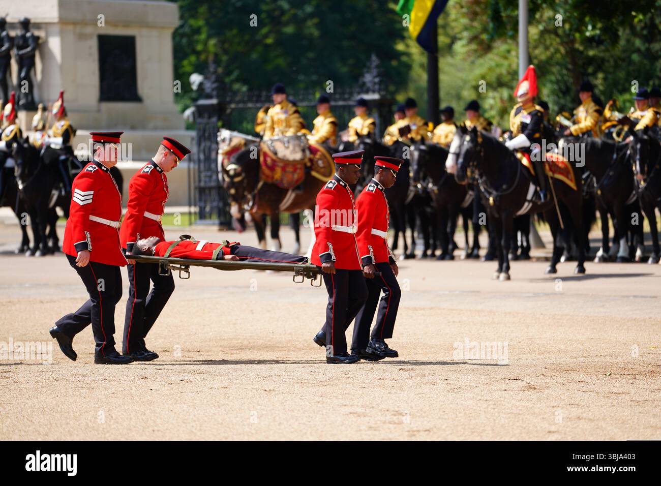LONDON, ENGLAND - JUNE 14: A soldier is stretchered off Horse Guards ...