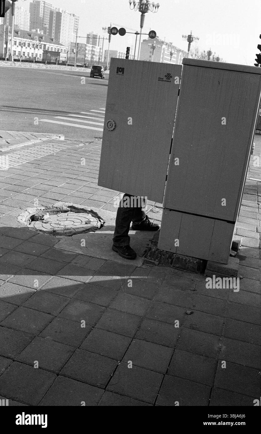 Early-2010s China City Street Worker Inspecting China Unicom Telecom ...