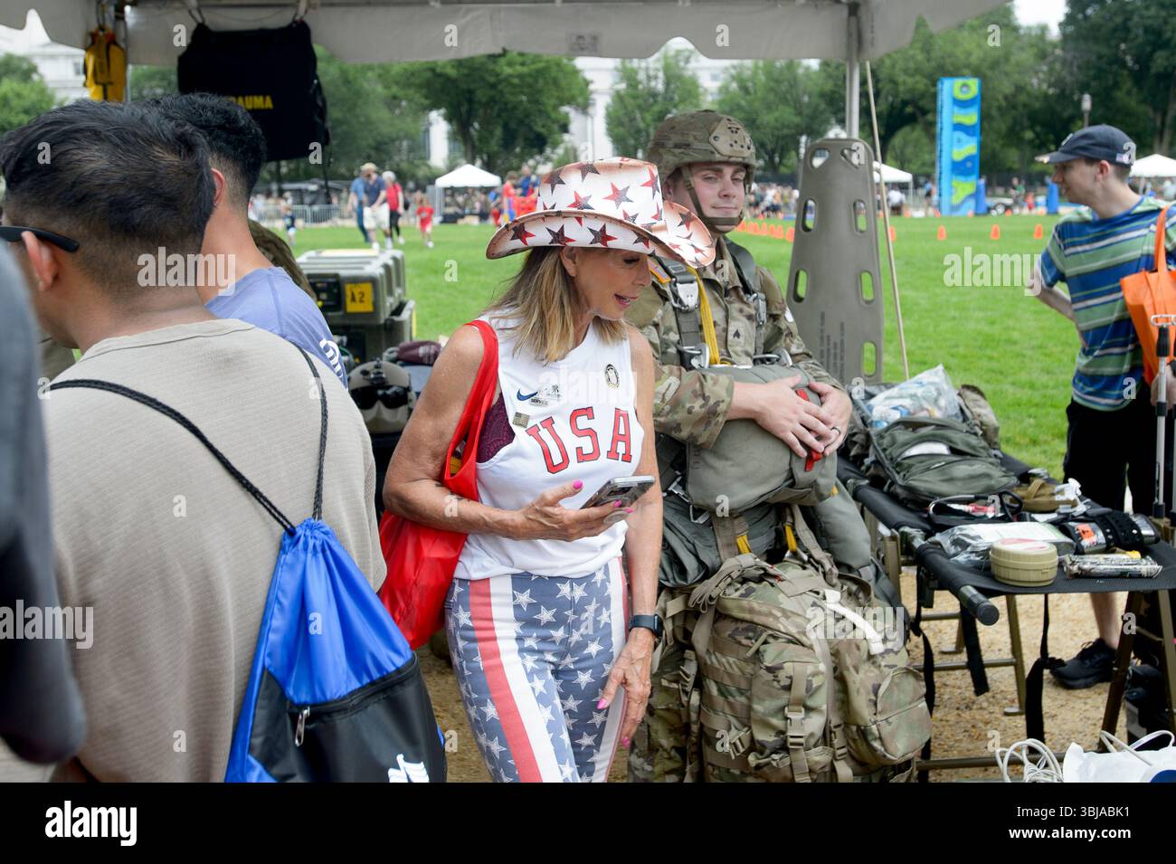 People visit booths featuring different aspects of the U.S. military ...
