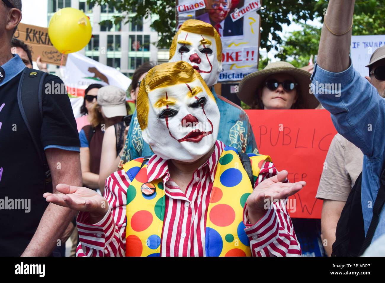 London, England, UK. 14th June, 2025. Protesters wear Trump clown masks ...
