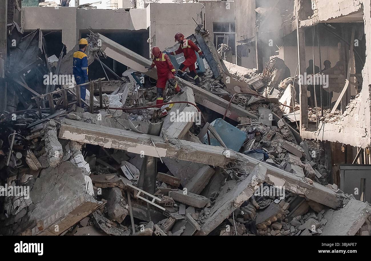 Tehran, Iran. 12th June, 2025. Iranian rescue teams search for ...