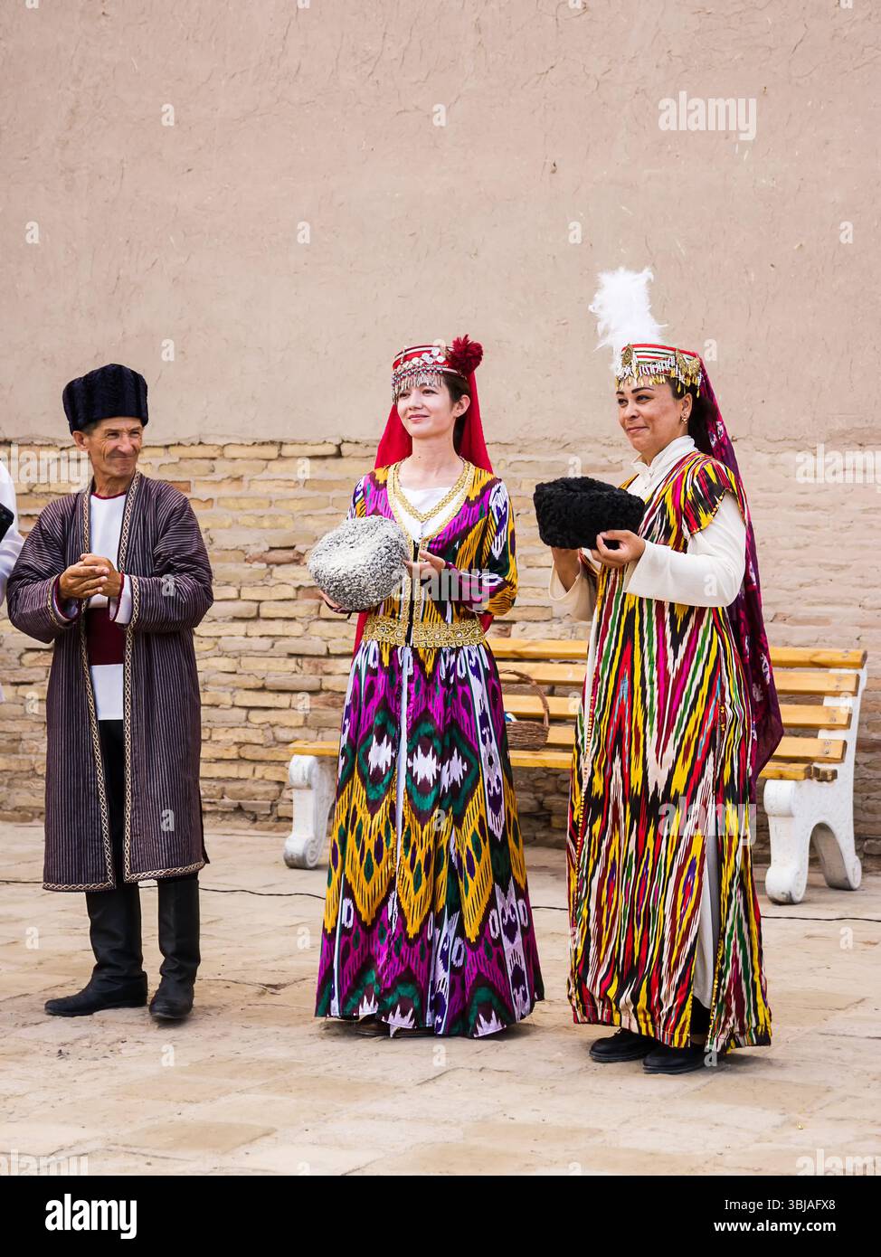 Khiva, Uzbekistan – July 11, 2024: A group of Uzbek performers wearing ...