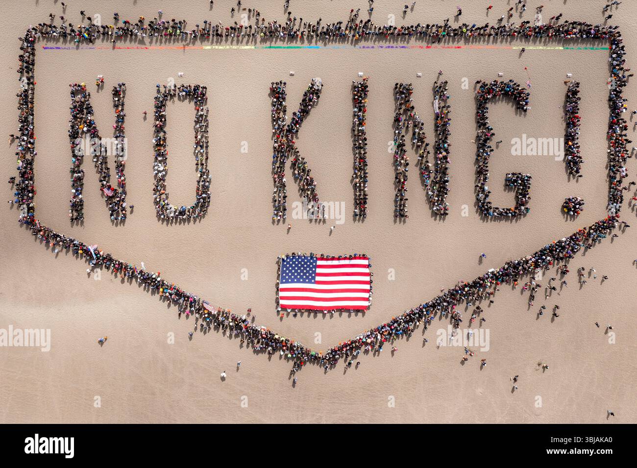 People form a human banner at Ocean Beach during the "No Kings ...