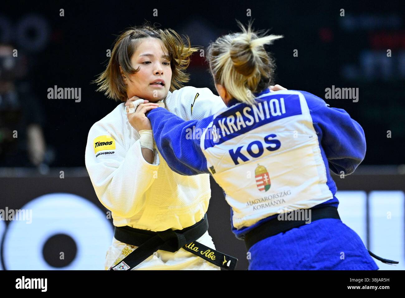 Uta Abe, in white, of Japan and Distria Krasniqi of Kosovo fight in the ...