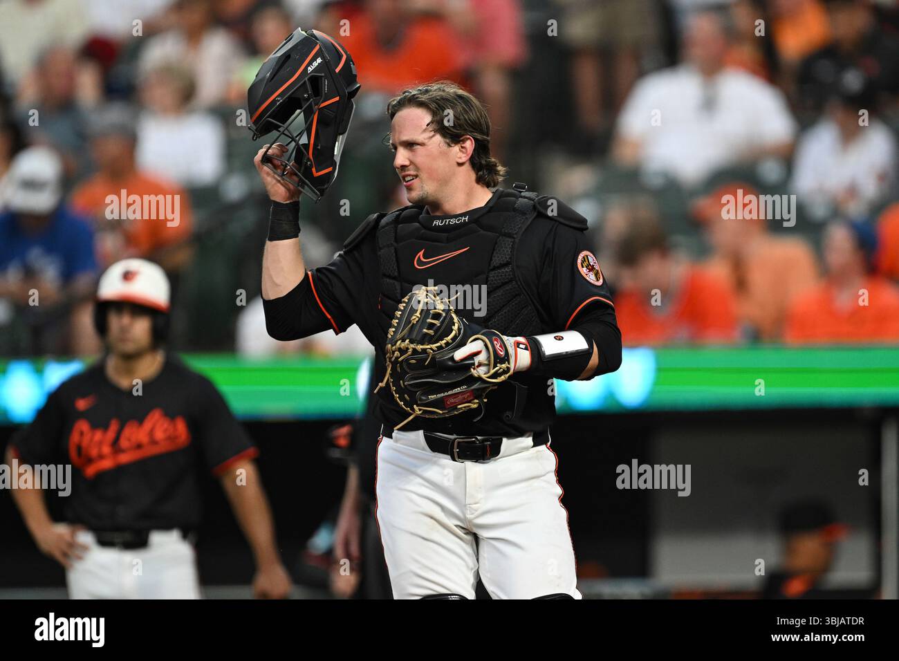 Baltimore Orioles catcher Adley Rutschman putting on his helmet during ...