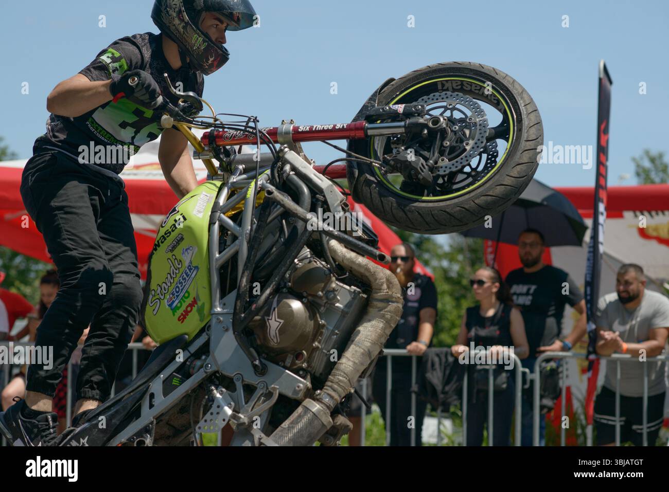 A stunt rider from the Extreme Attack team performs a high-angle ...