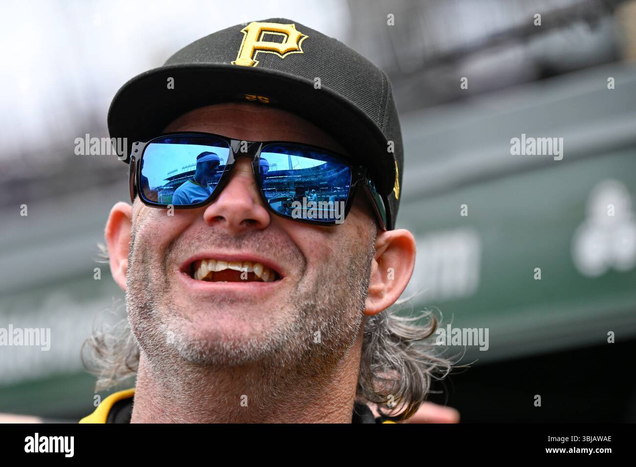 Pittsburgh Pirates' Andrew McCutchen is reflected in the sunglasses of ...