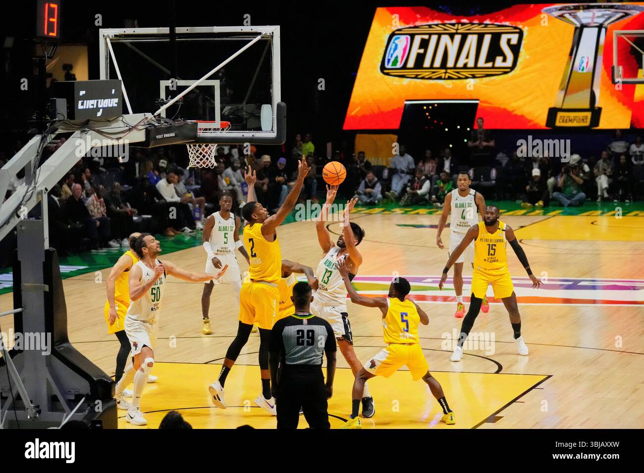 Al Ahli Tripoli captain Mohamed Sadi (13) shoots against Petro de ...