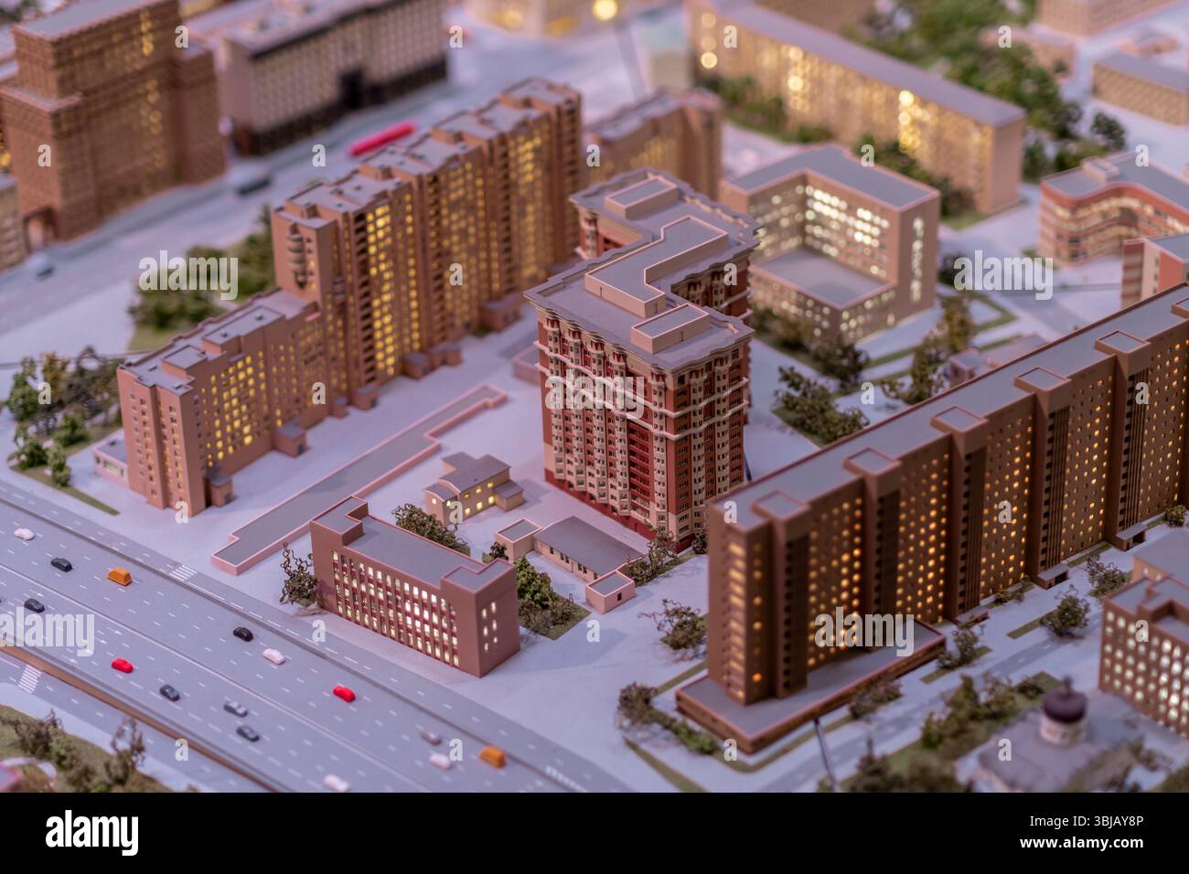 A close-up view reveals a realistic model of a modern city block during ...