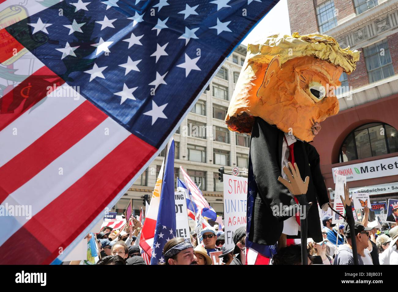 Los Angeles, USA. 14th June, 2025. A protester carries a paper mache ...