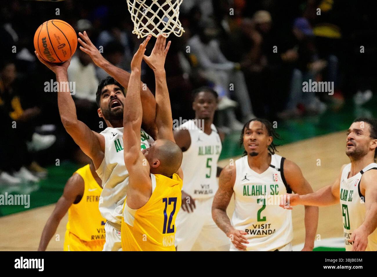 Al Ahli Tripoli captain Mohamed Sadi (13) shoots against Petro de ...