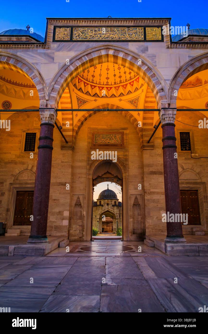 The arches of the Suleymaniye Mosque courtyard leading to a serene ...