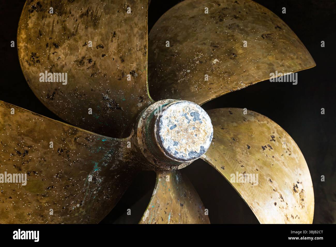 Five bladed ship propeller close-up, with zinc corrosion protection in ...