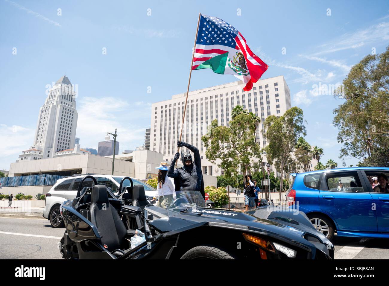 A demonstrator wears a costume during a protest Saturday, June 14, 2025 ...