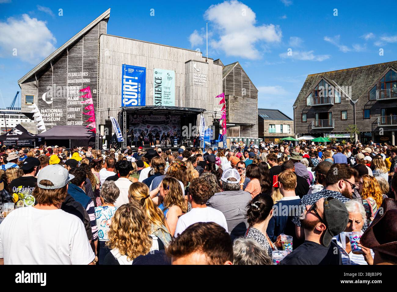 Falmouth, UK. 14th June 2025. Spectators watch performances on stage at ...