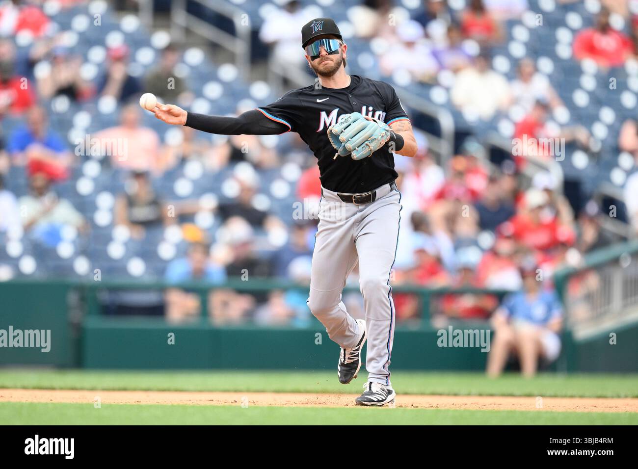 Miami Marlins third baseman Connor Norby (1) throws to first base to ...