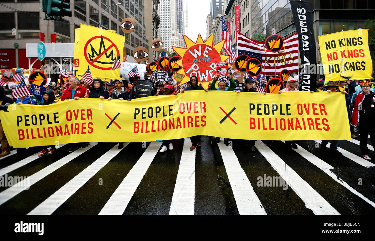 New York, United States. 14th June, 2025. Protesters hold signs and ...