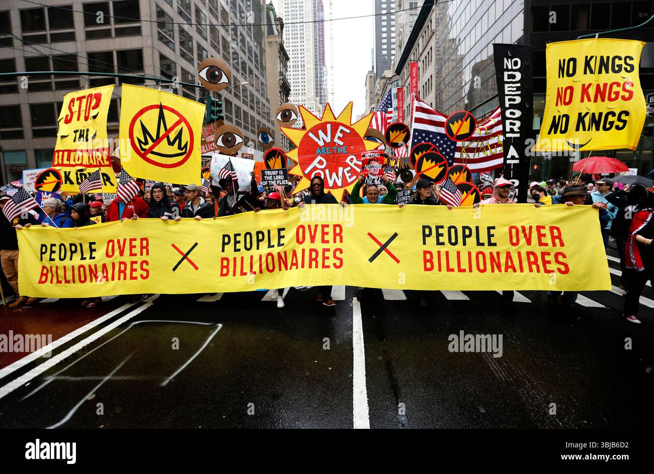 New York, United States. 14th June, 2025. Protesters hold signs and ...