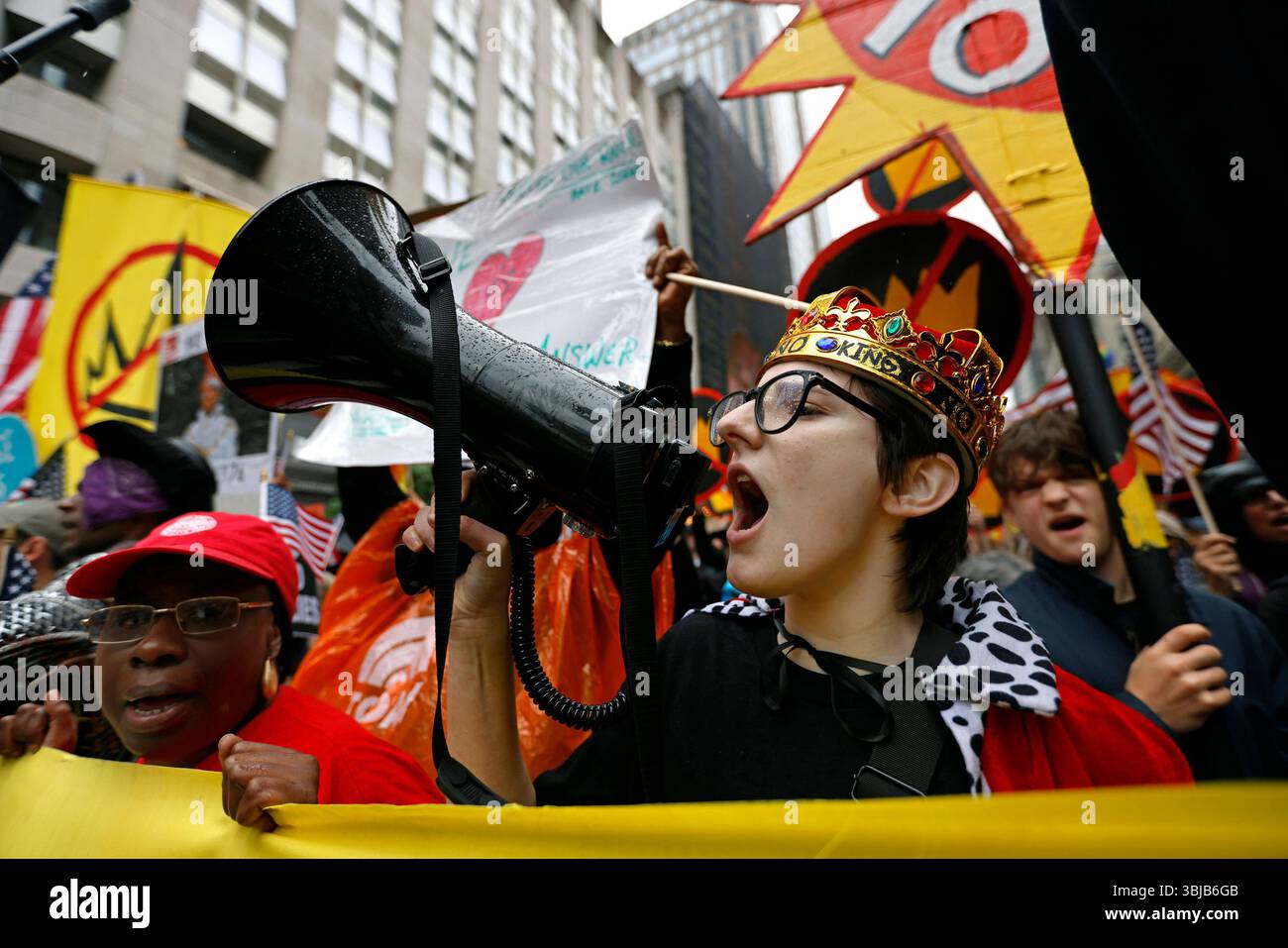 New York, United States. 14th June, 2025. A protester shouts through a ...