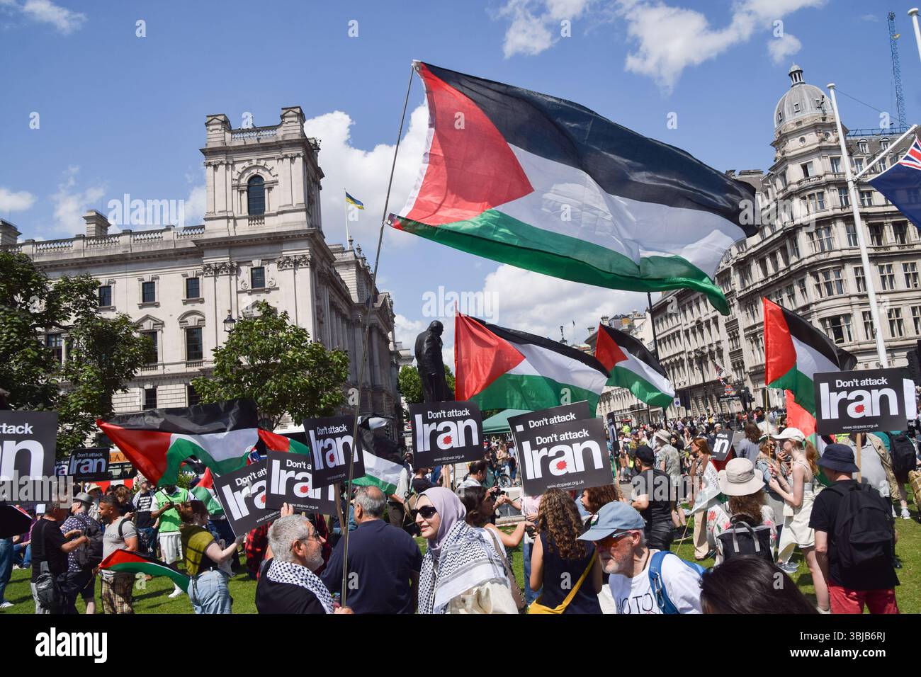 London, UK. 14th June, 2025. Protesters hold 'Don't attack Iran ...