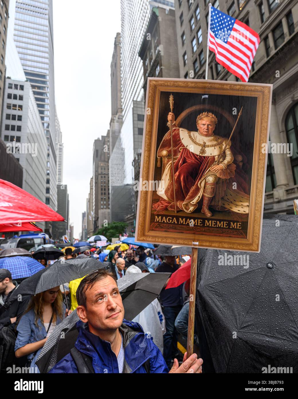 New York, USA. 14th June, 2025. People defy the rain and carry anti ...