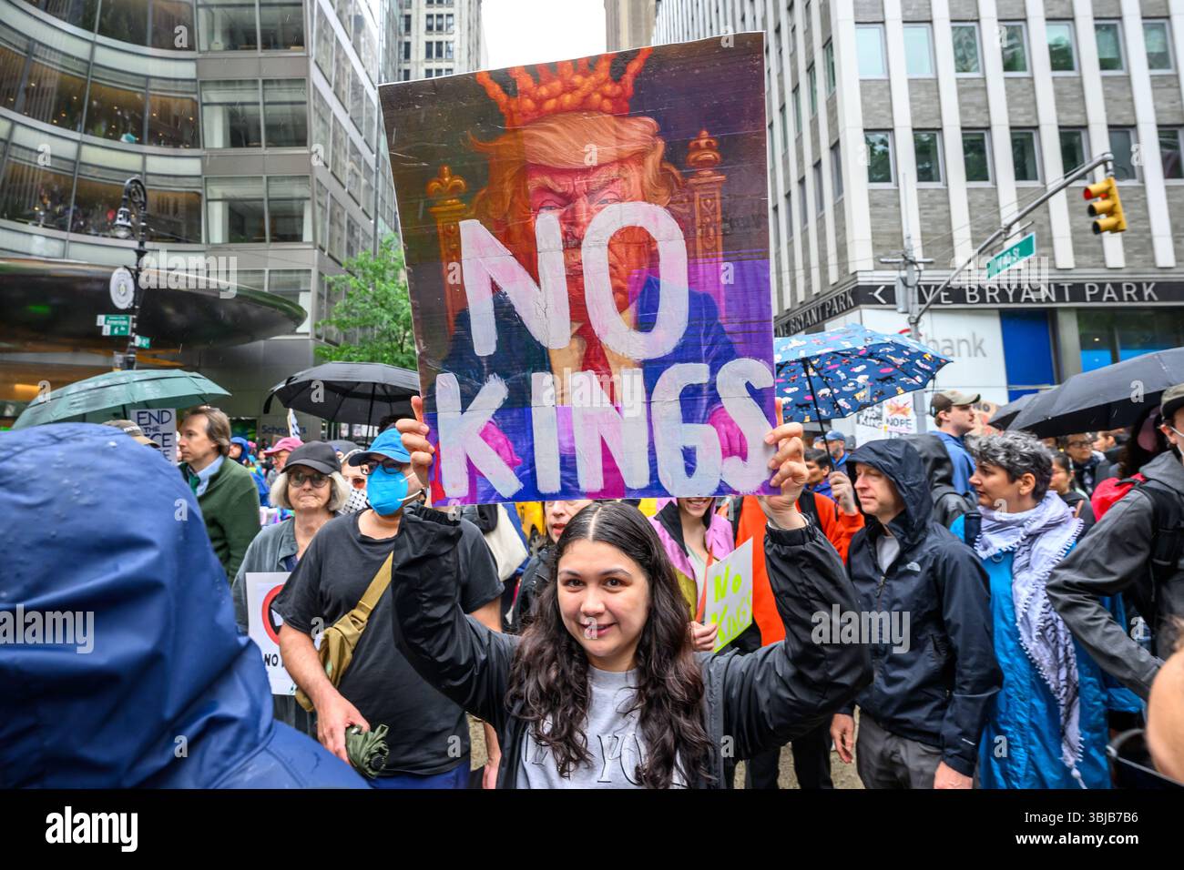 New York, USA. 14th June, 2025. People defy the rain and carry anti ...