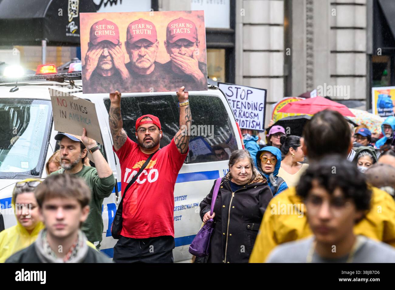 New York, USA. 14th June, 2025. People defy the rain and carry anti ...