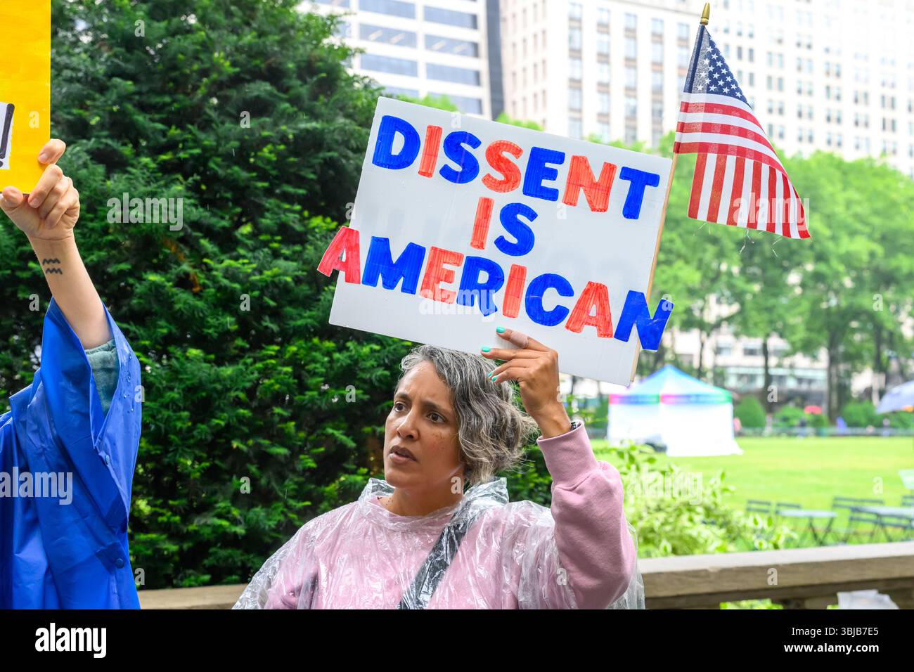 New York, USA. 14th June, 2025. People defy the rain and carry anti ...