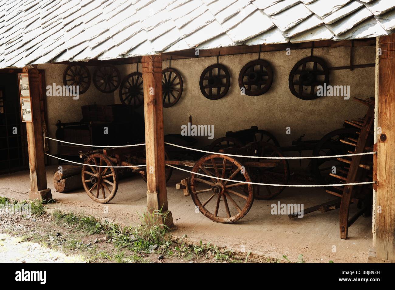 Old wooden carts and wheels inside an open-air museum in Staro Selo ...