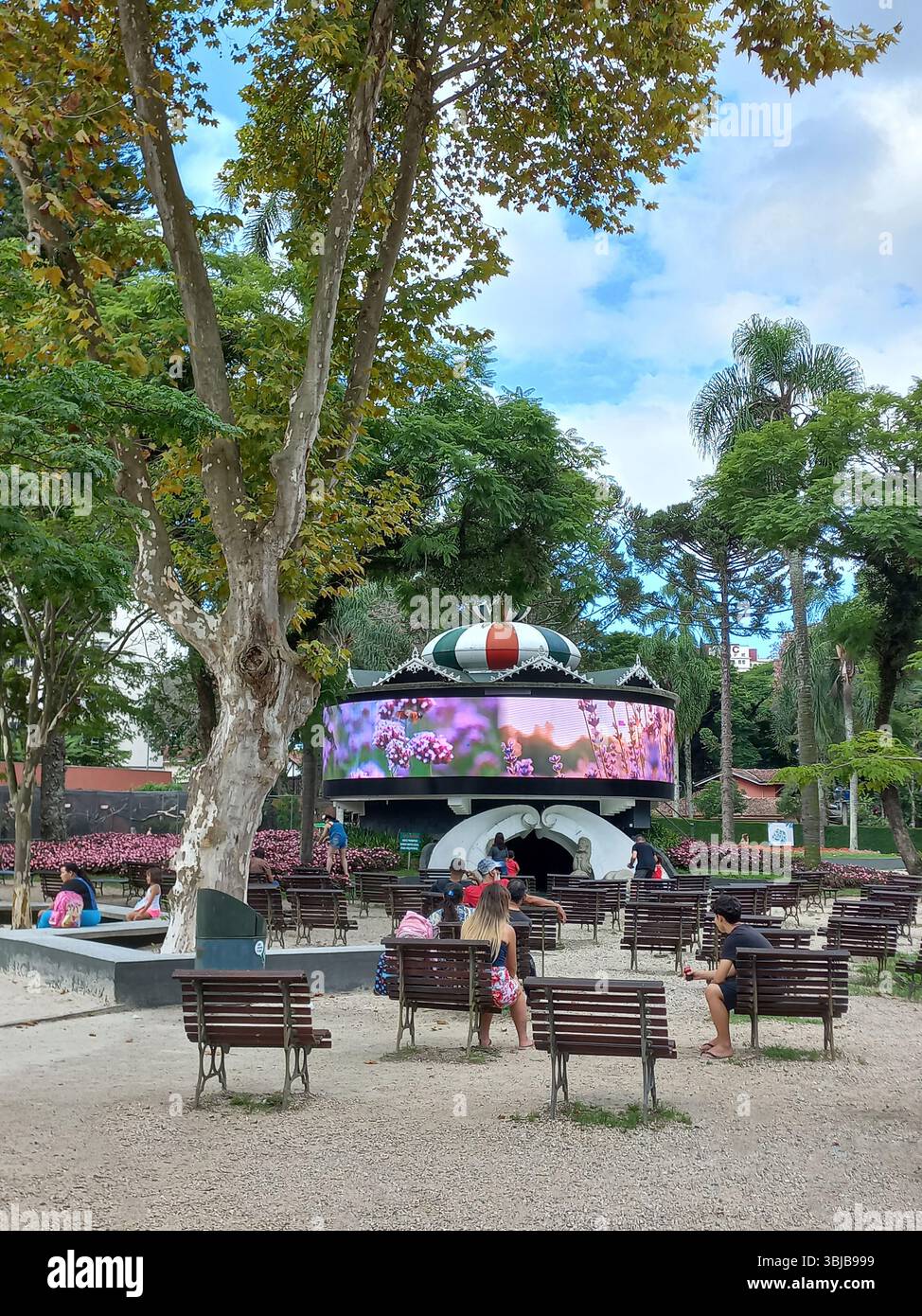 Curitiba Paraná Brazil February 3 2024 Visitors seated on benches near domed kiosk surrounded by ...