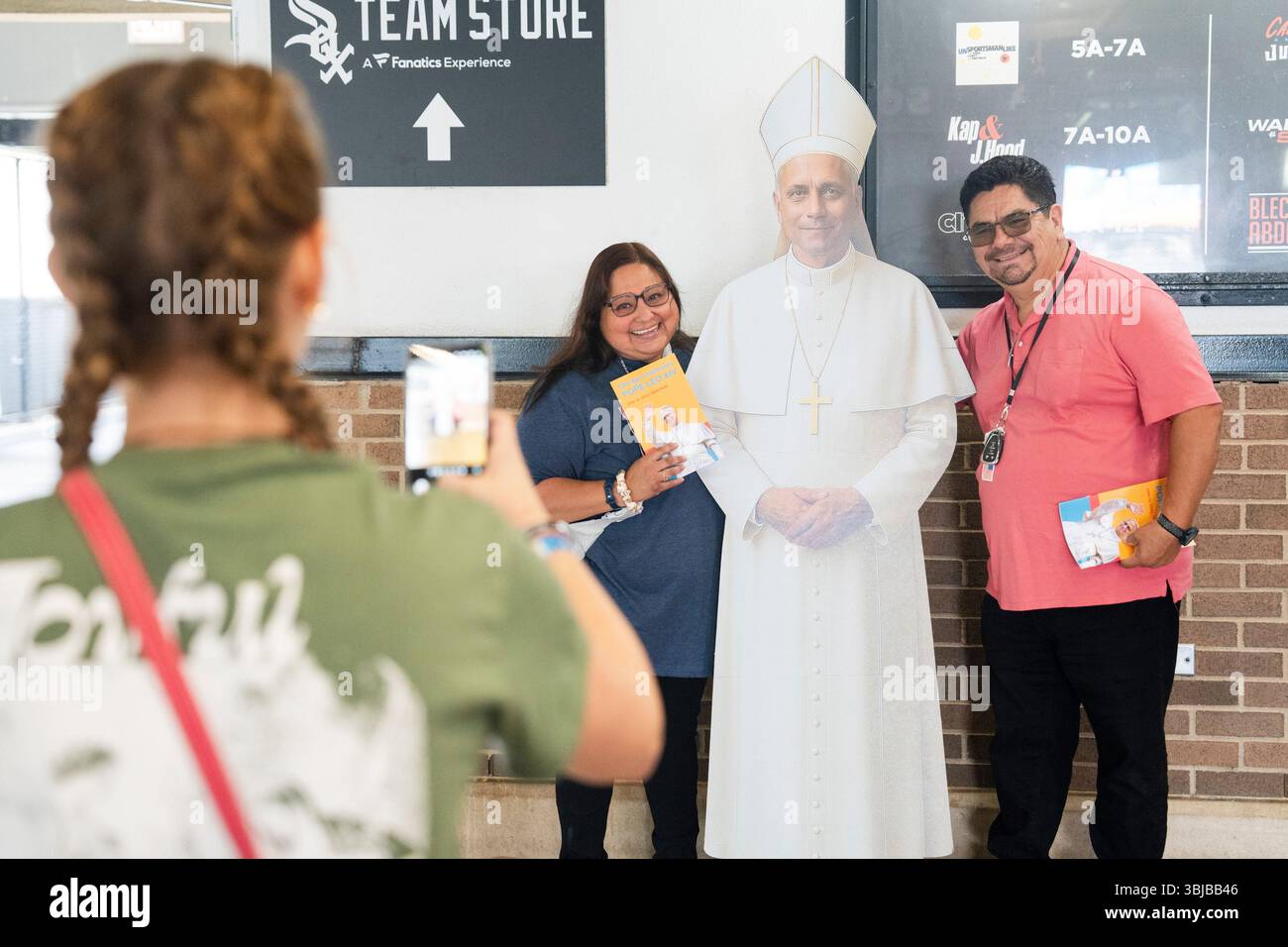 Maria Marin and her husband, Martin Marin, pose with a cardboard cutout ...