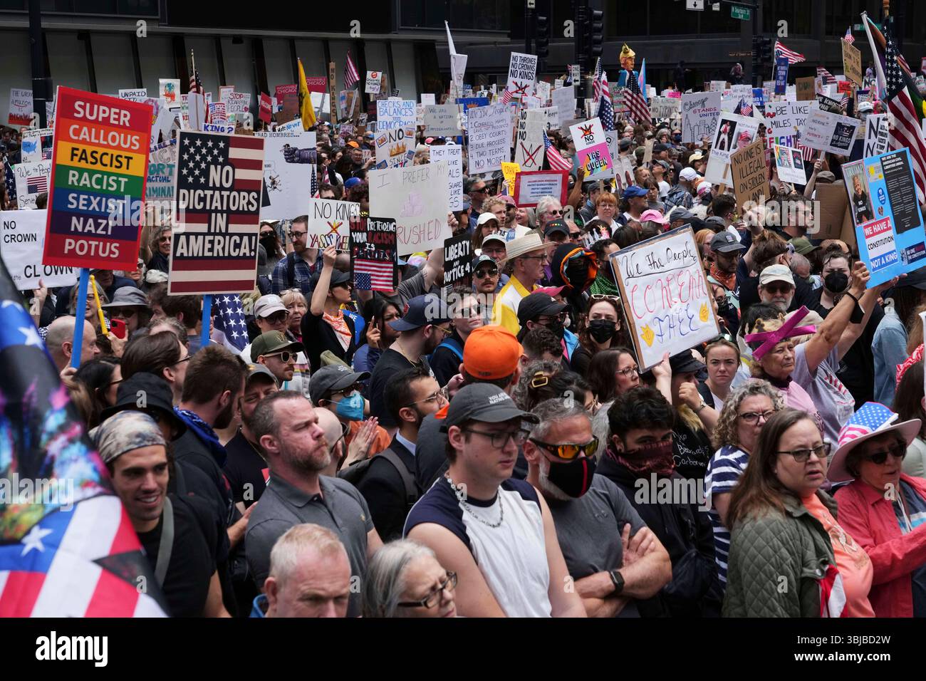 People take part in the "No Kings Day" protest, Saturday, June 14, 2025 ...