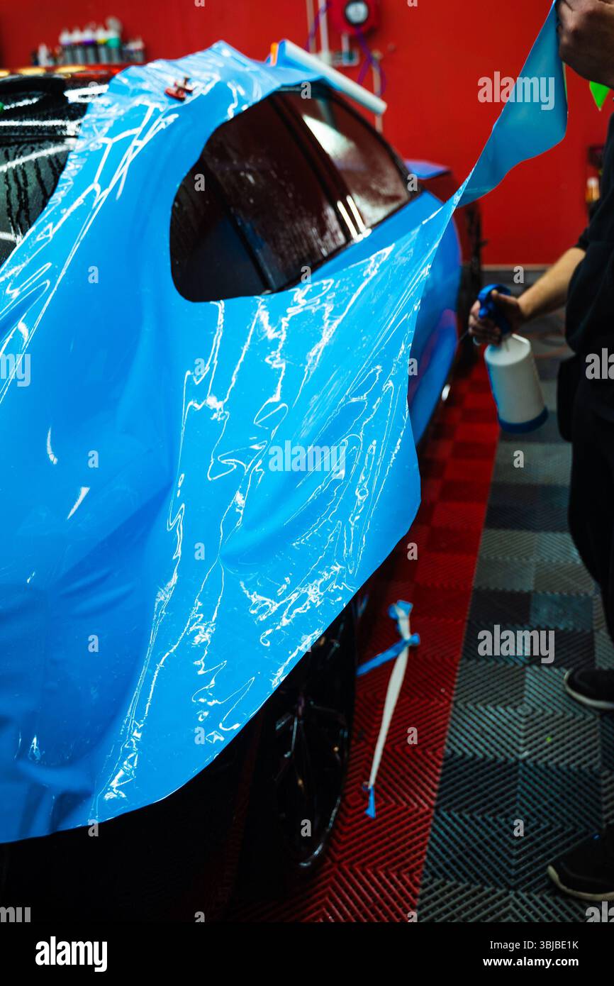 Detailer uses spray-assisted method to apply vibrant blue vinyl wrap ...