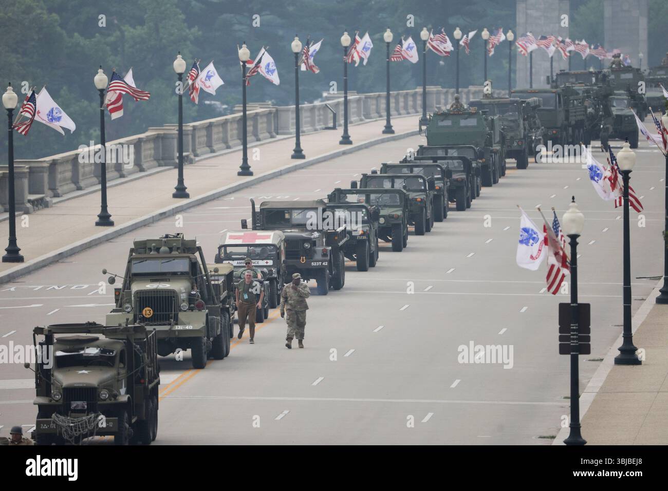 Military vehicles drive over the Memorial Bridge during a military ...