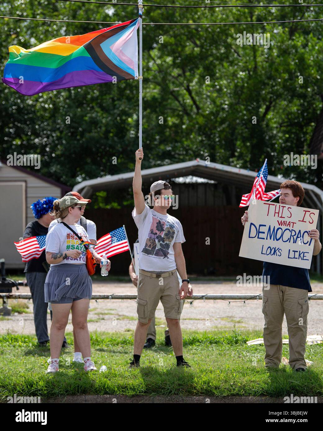 Demonstrators gather along Texas Avenue near the Brazos County ...