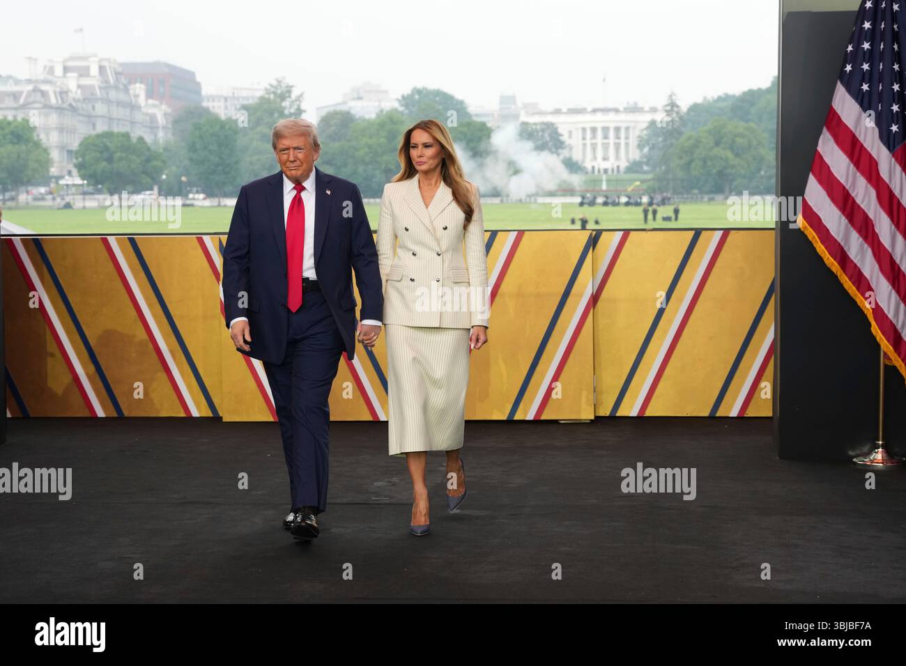 President Donald Trump and first lady Melania Trump arrive for a parade ...