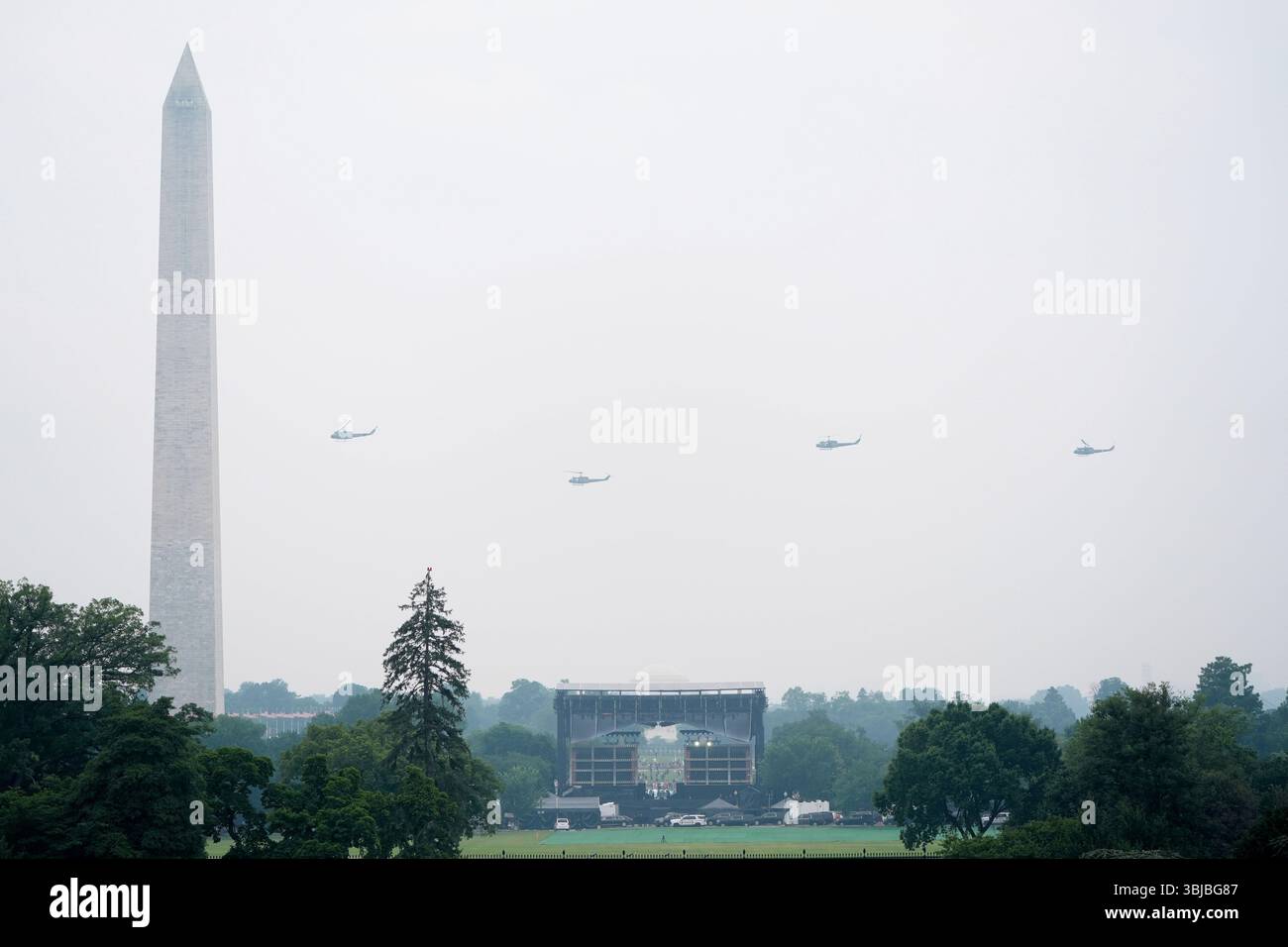 U.S. Army UH-60M Black Hawk helicopters perform a flyover during an ...