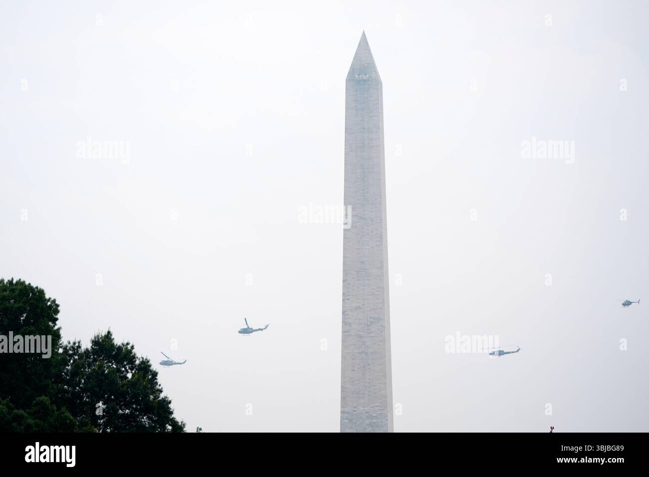 U.S. Army UH-60M Black Hawk helicopters perform a flyover during an ...