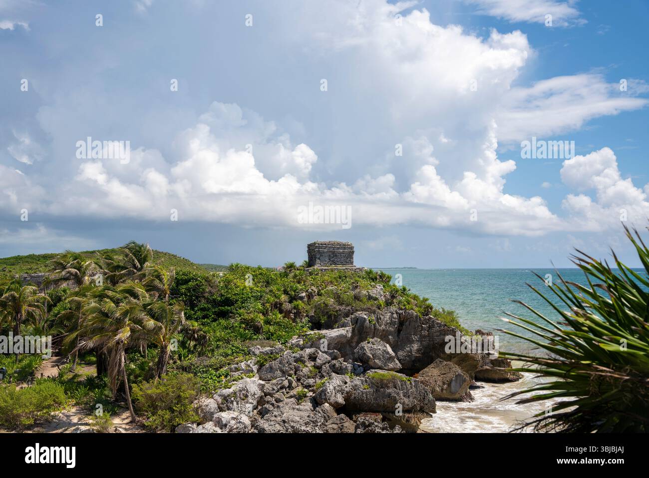Temple of the Wind God overlooking turquoise Caribbean sea with lush ...