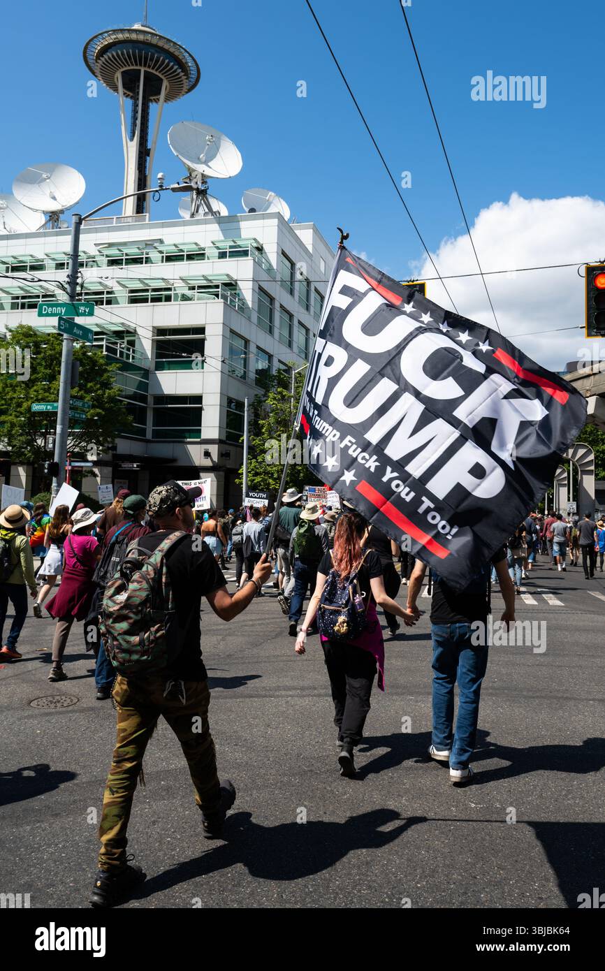 Seattle, USA. 14th Jun 2025. Protestors at the No Kings rally marching ...