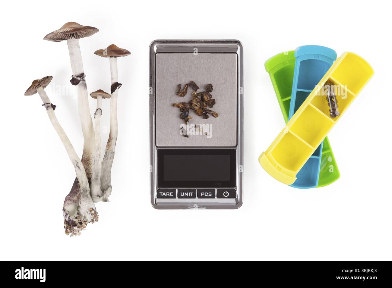 Magic mushrooms medicine, microdosing, pillbox, digital scale, isolated ...