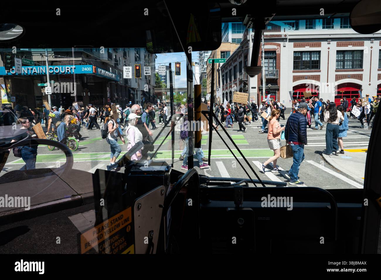 Seattle, USA. 14th Jun 2025. Protestors at the No Kings rally marching ...