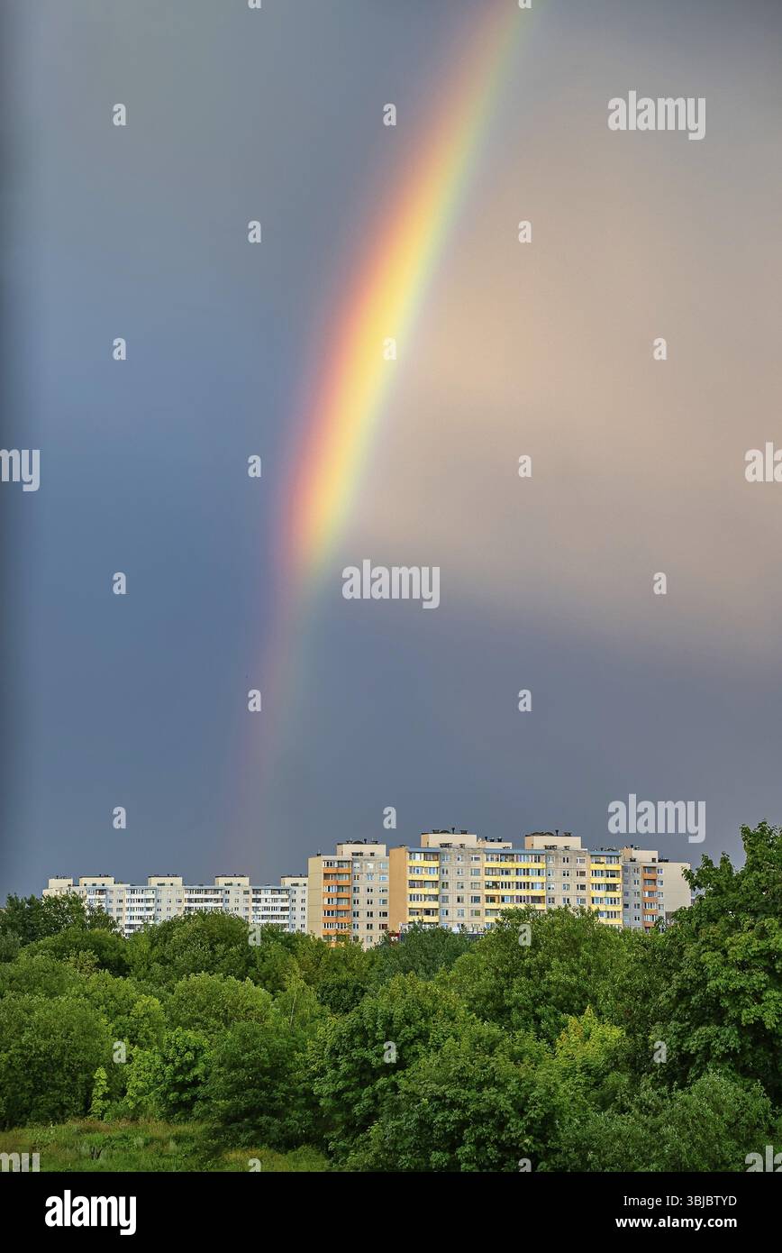 Beautiful big rainbow over apartment buildings Stock Photo - Alamy