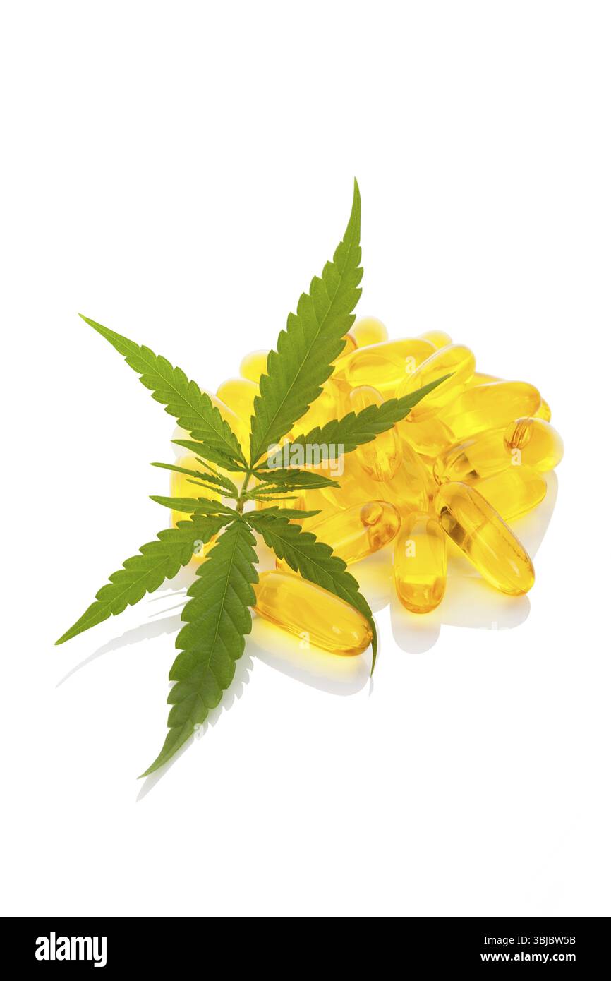 Medical marijuana. Cannabis leaf and tablets isolated on white ...