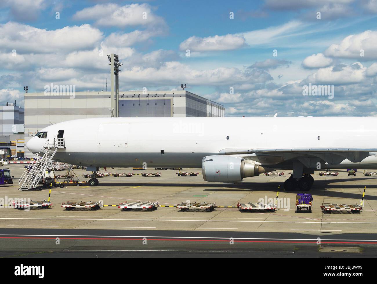 Cargo aircraft is loading at the airport Stock Photo - Alamy