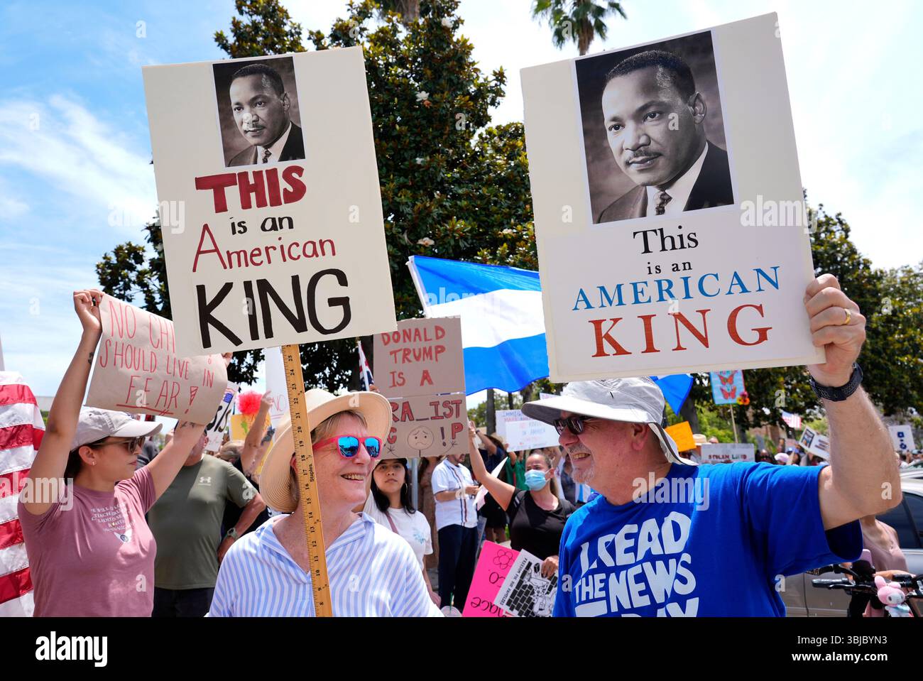 Mark Salter, right, and his wife, Sally of Whittier, Calif., hold signs ...