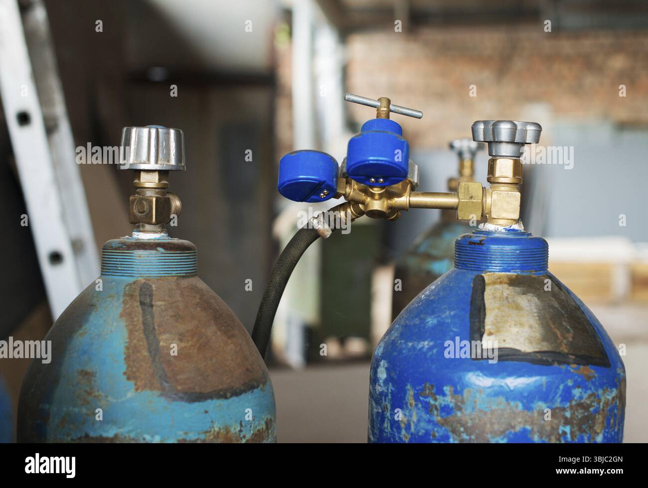 Propane gas balloons with pressure meter Stock Photo - Alamy